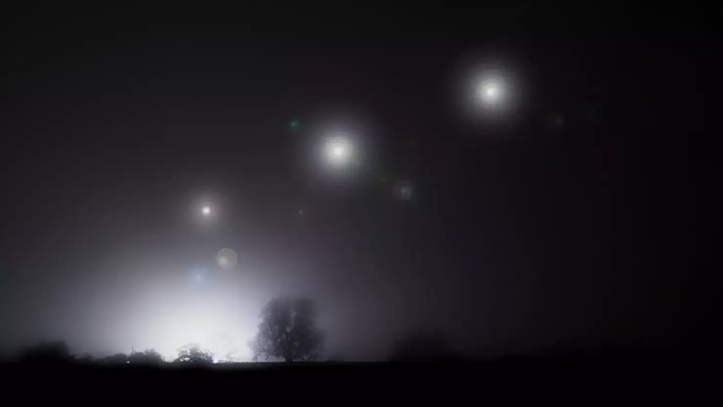 Family Films Huge Cluster Of White Lights Floating Across Night Sky ...